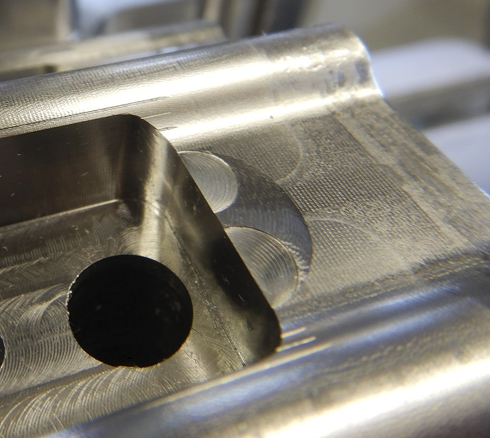 Tool gouges top sloping faces when using Constant Z strategy in PowerMill,